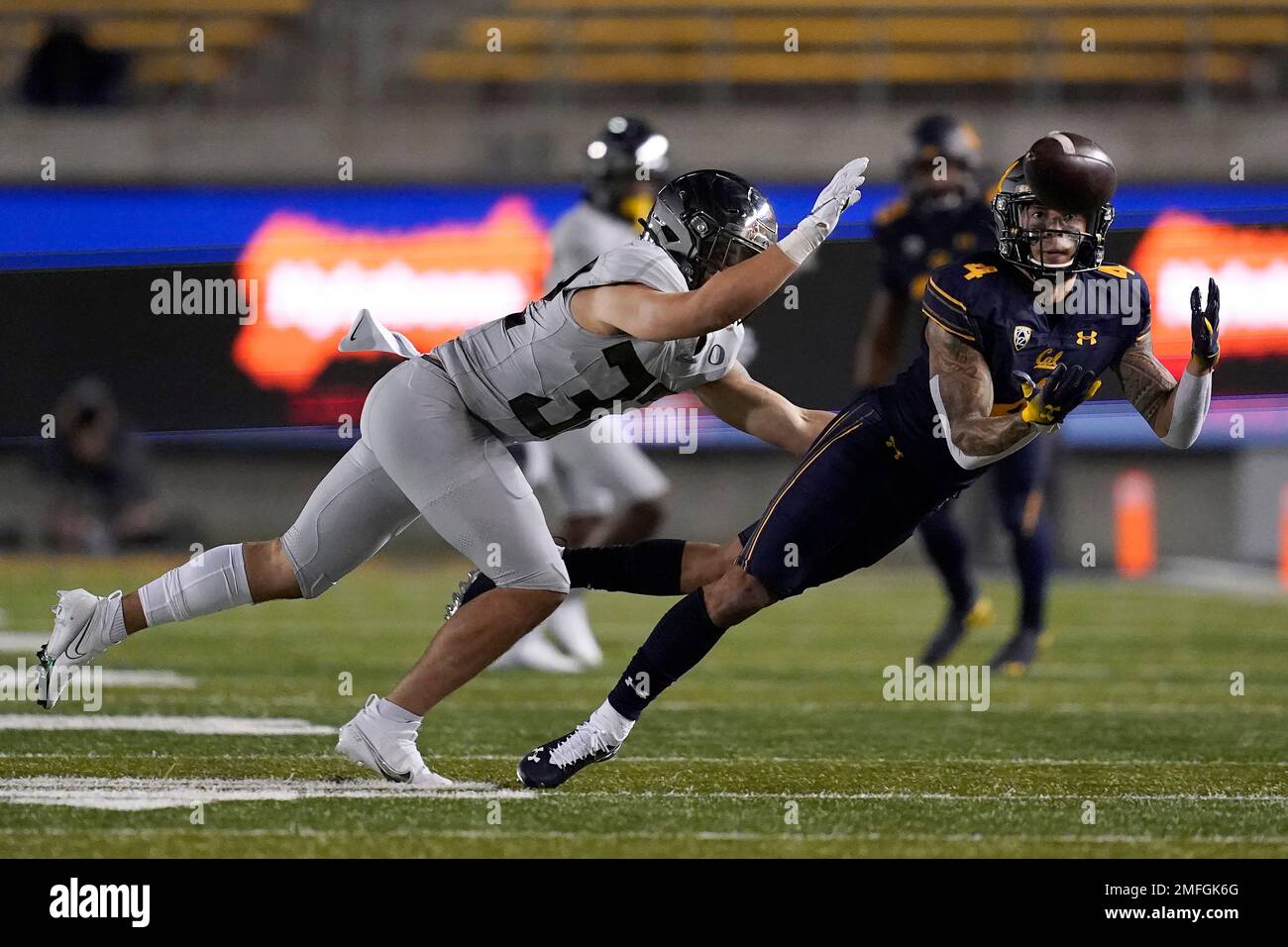 California wide receiver Nikko Remigio, right, catches a pass in front ...