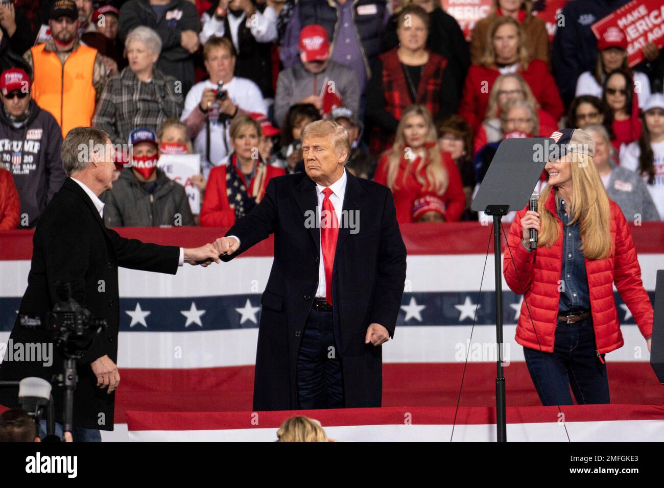 President Donald Trump shares the stage with U.S. Sens. Kelly Loeffler ...