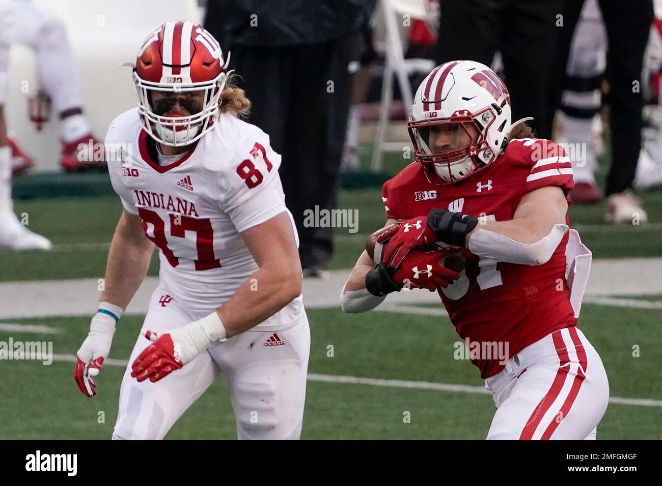 Wisconsin running back Garrett Groshek runs past Indiana's Michael ...