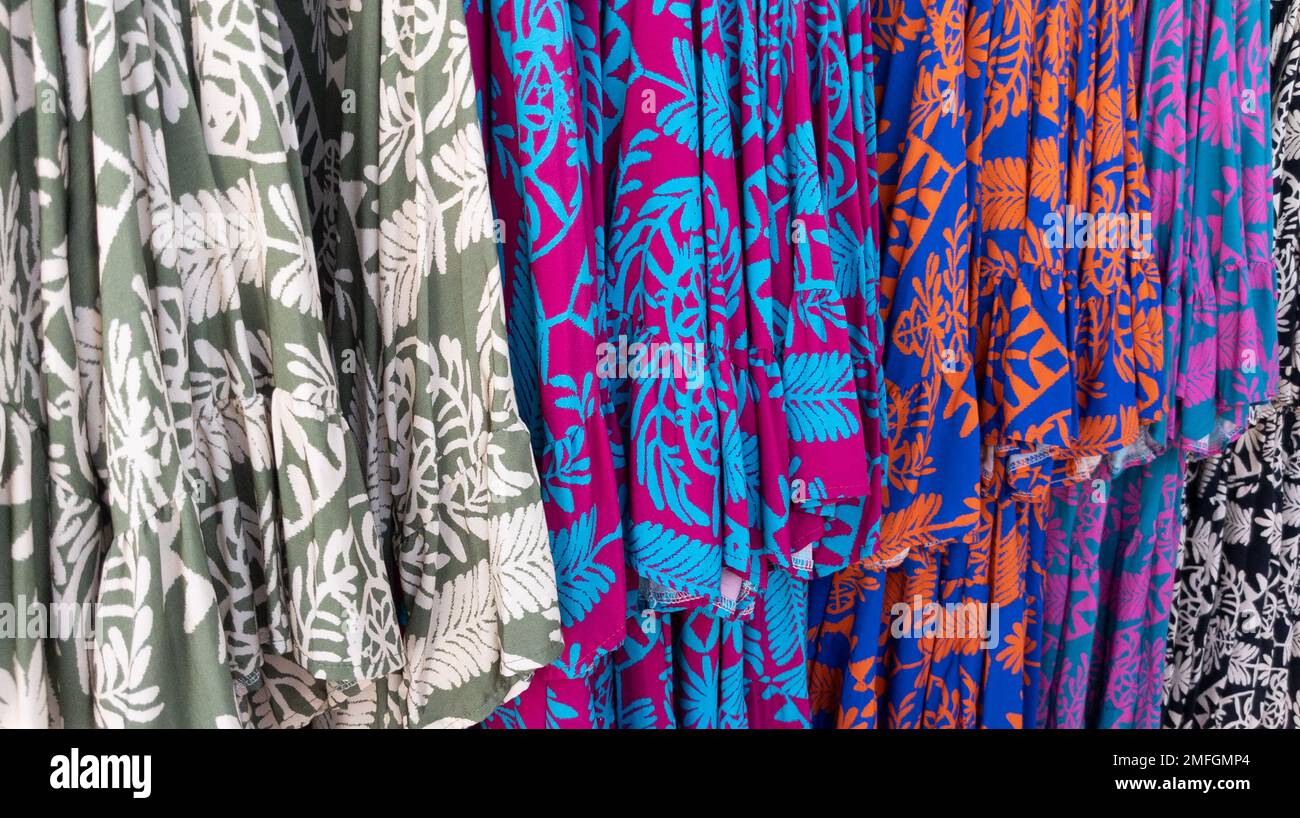 different dresses and patterned fabric shop fashionable background ...