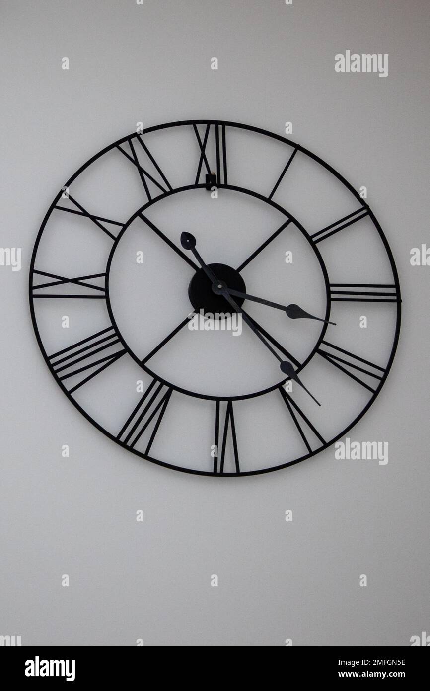 Vintage timer Old big Black Clock in wall interior with roman numerals ...