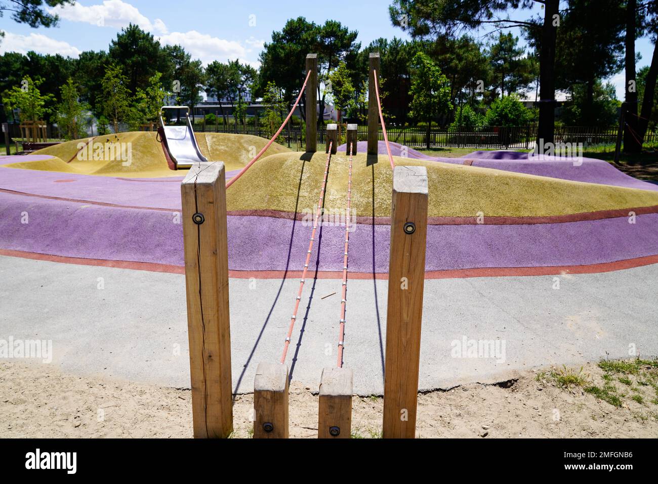 Children changing rope path wooden playground on park street Stock ...