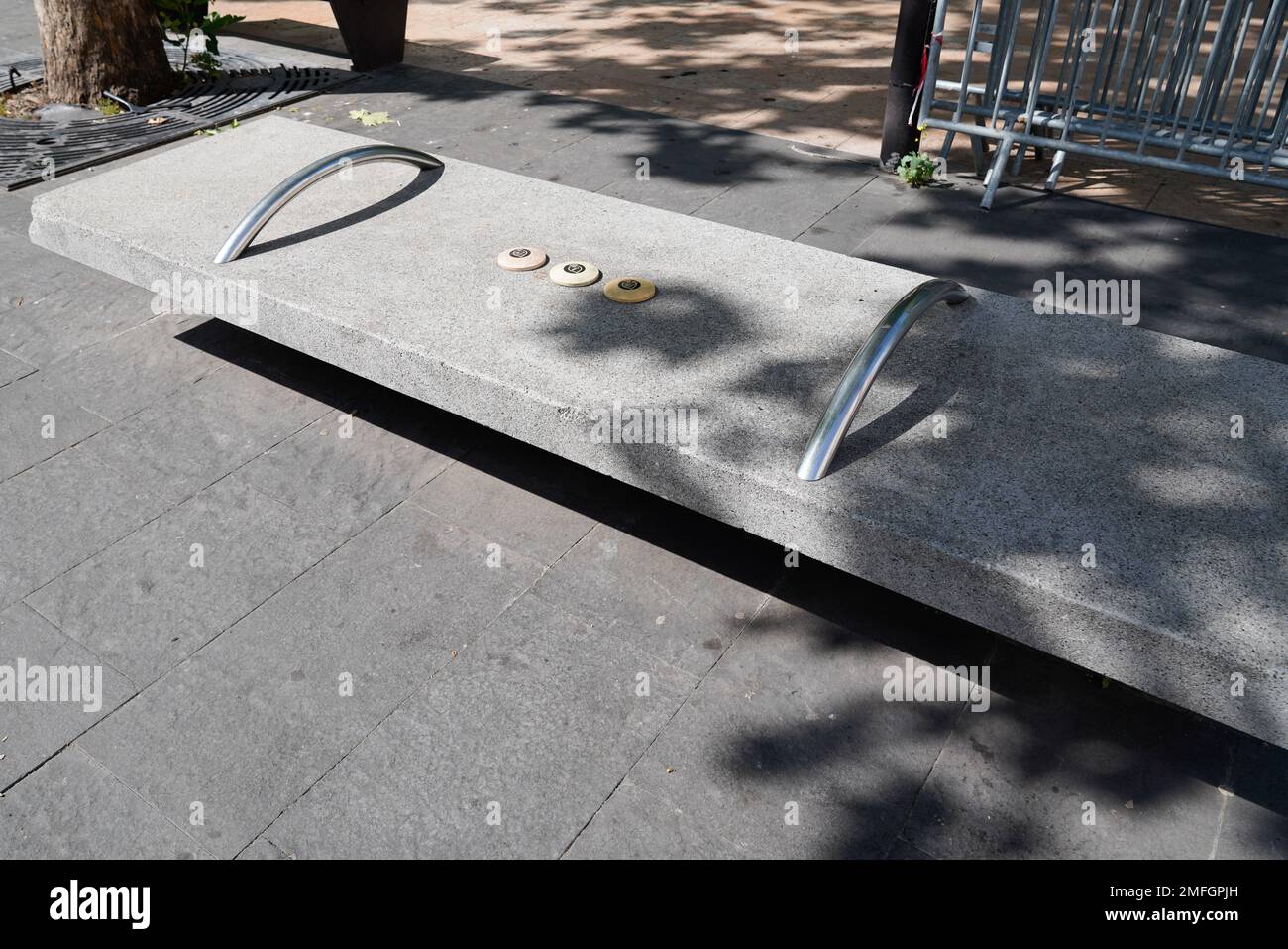 Hostile architecture defensive bench with metal armrests designed to ... Hostile architecture defensive bench with metal armrests designed to ...
