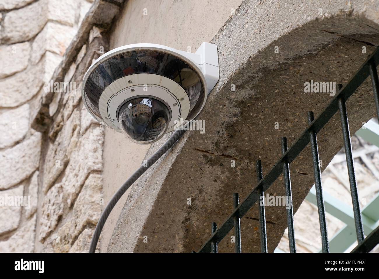 Security modern round new 360 white camera on facade wall building ...