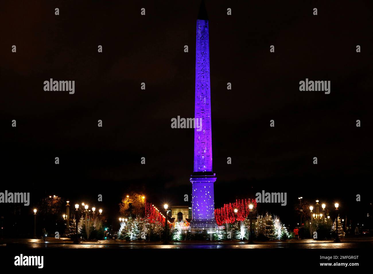 The Concorde Obelisk, foreground, and the Arc de Triomphe, background ...