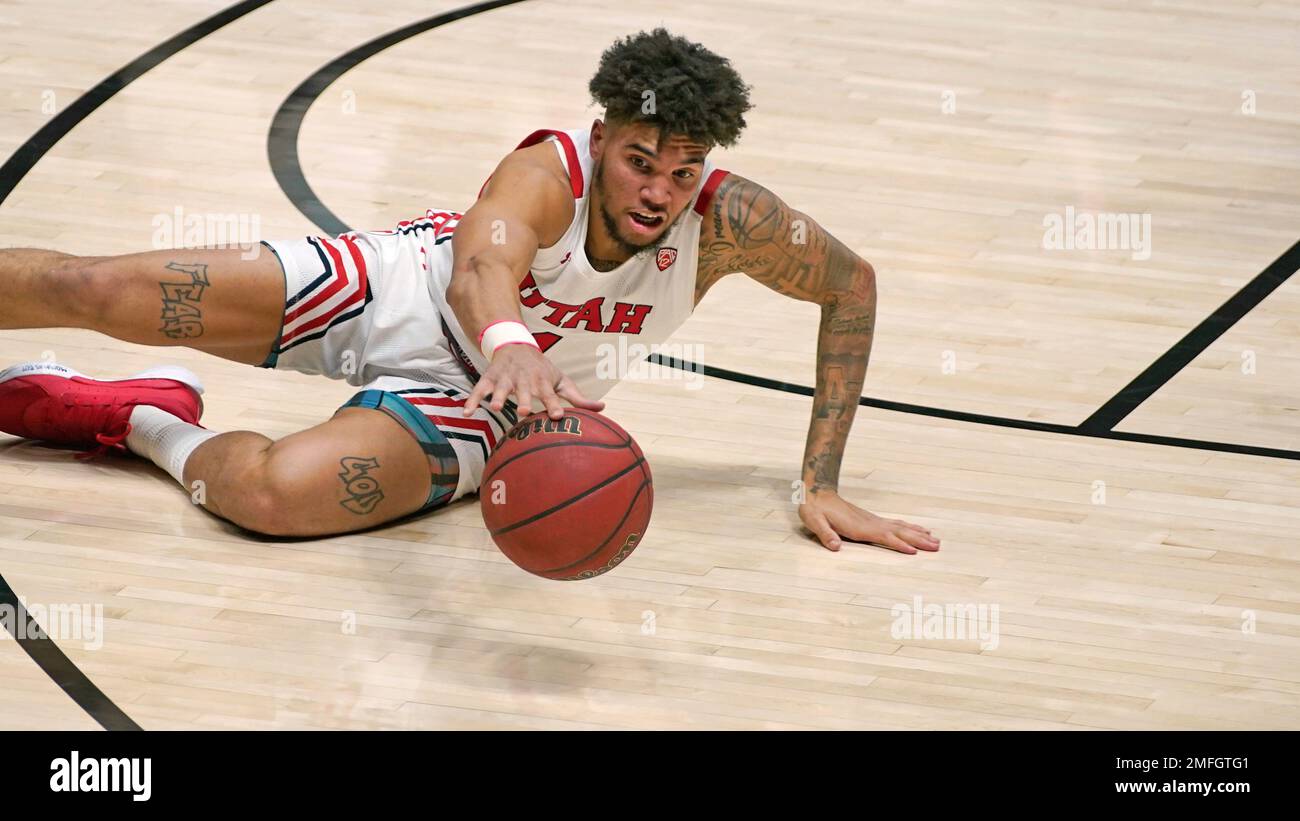 Utah forward Timmy Allen (1) dives for a loose ball in first half ...