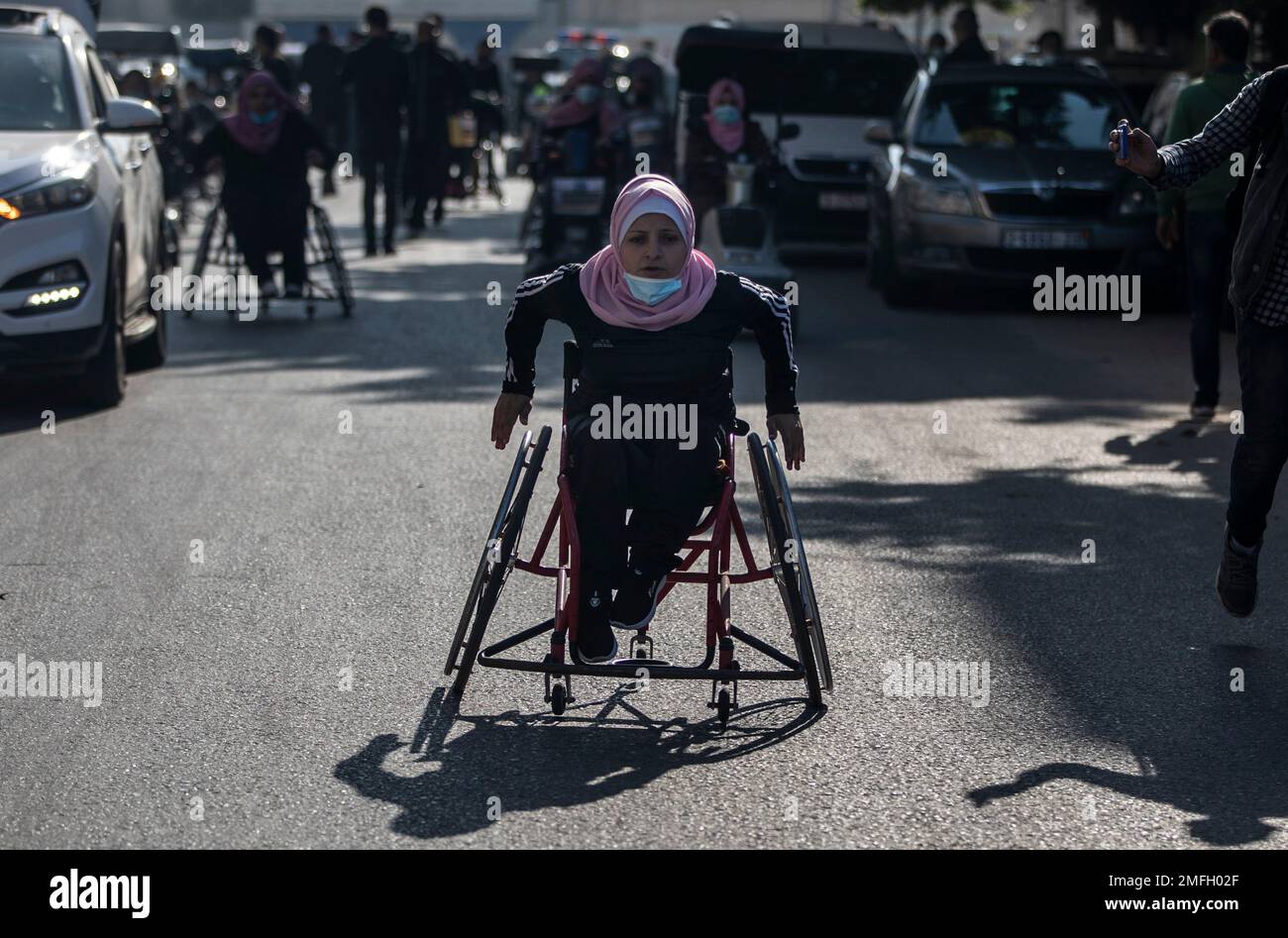 Disabled Palestinian woman competes in a race marking the International ...