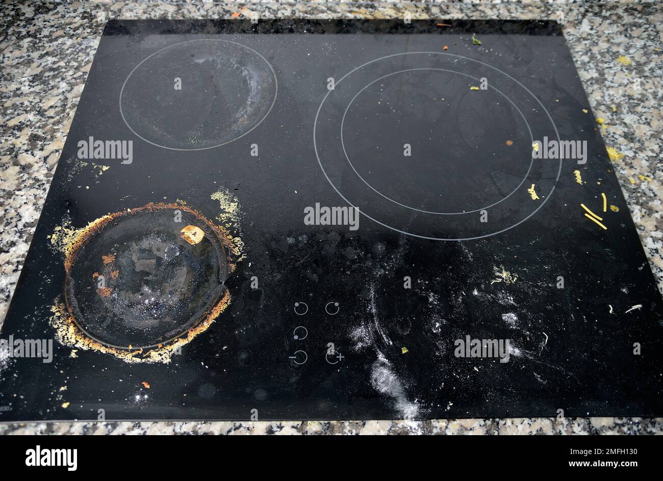 Dirty ceramic kitchen stove in kitchen room Stock Photo - Alamy