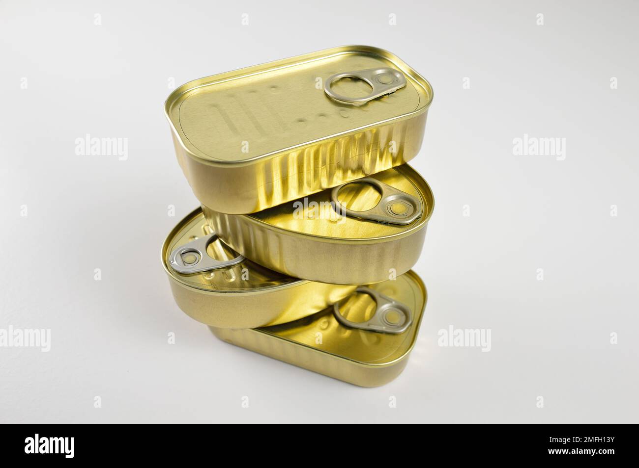 Collection of cans of canned unopened fish on white background Stock ...