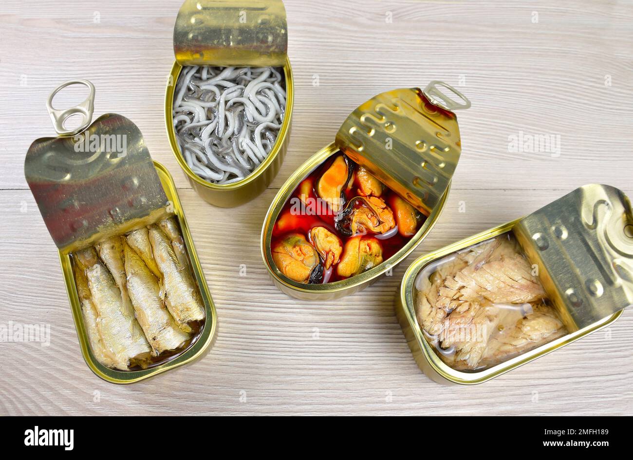 Assortment of cans of canned with different types of fish and seafood ...