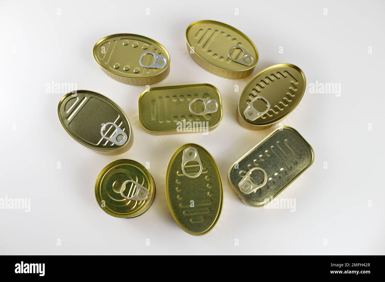 Collection of cans of canned unopened fish on white background Stock ...
