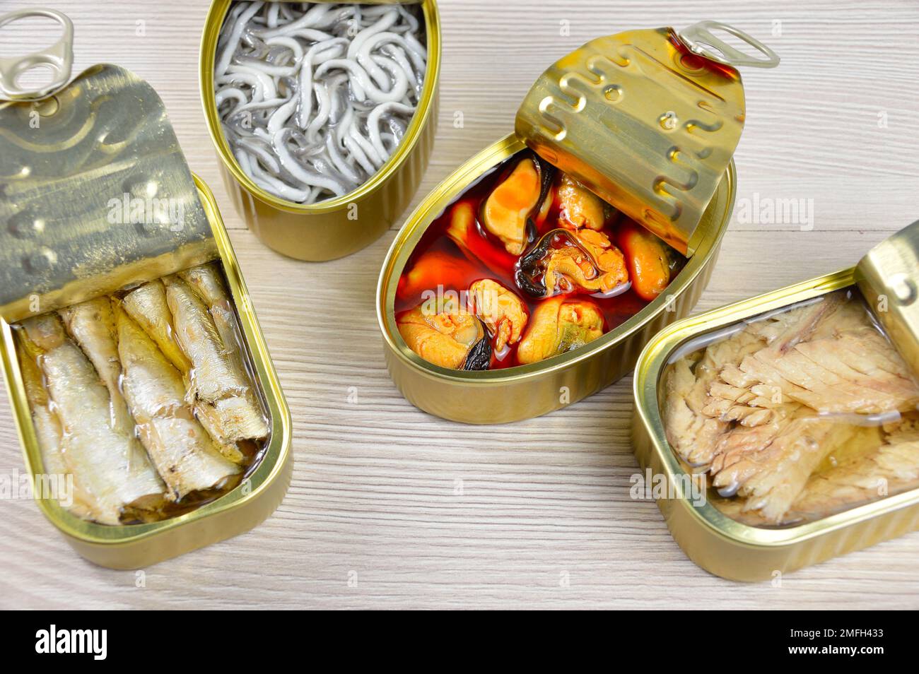 Assortment of cans of canned with different types of fish and seafood ...