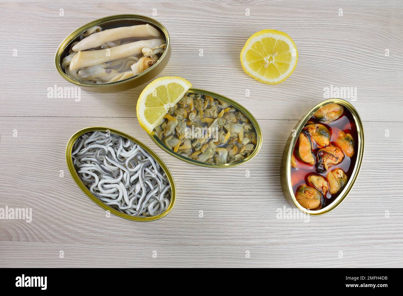 Assortment of cans of canned with different types of fish and seafood ...