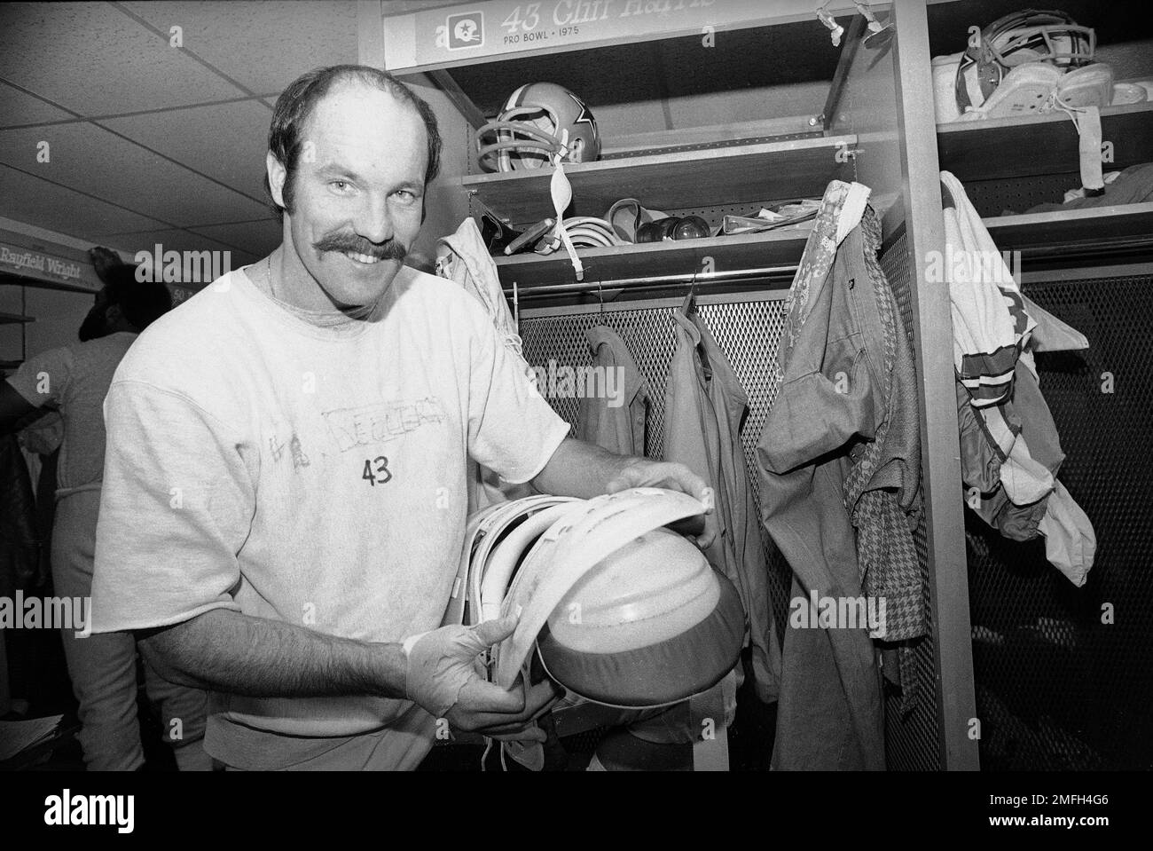 Dallas Cowboys safety Cliff Harris gets his equipment in order before ...