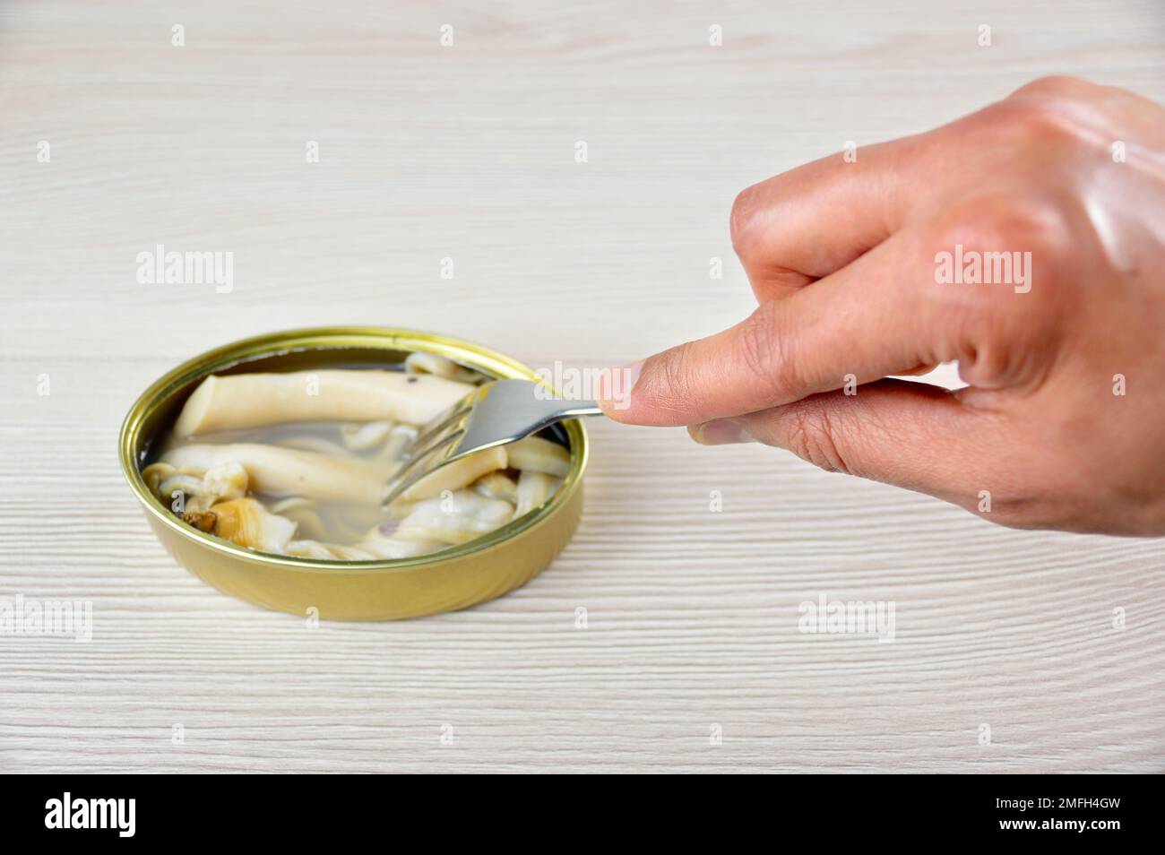 Man eating canned food hi-res stock photography and images - Alamy