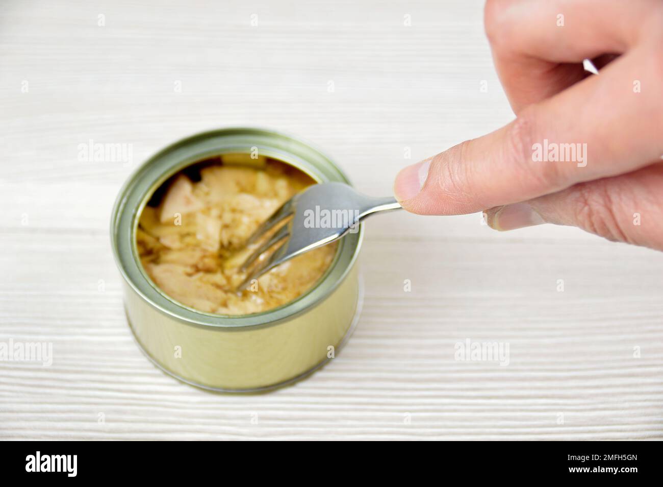 Man eating canned food hi-res stock photography and images - Alamy