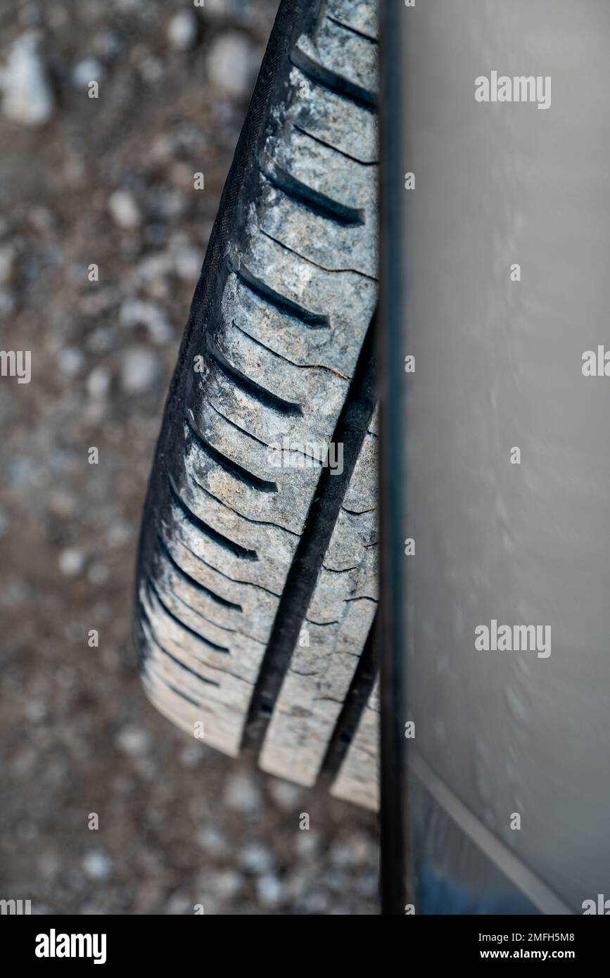 Top view of worn and worn car tire and car Stock Photo - Alamy