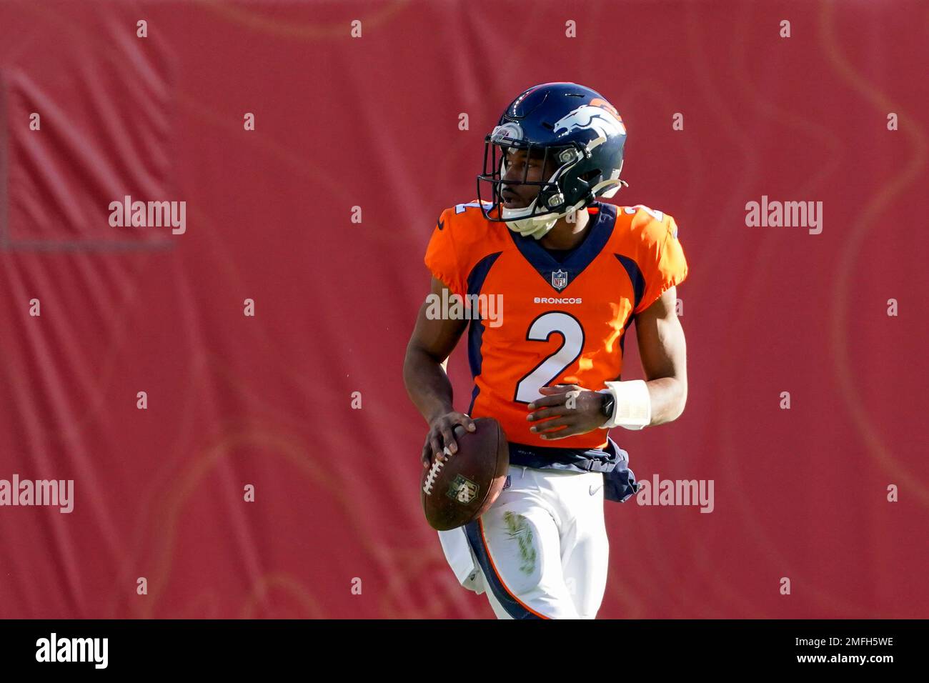 Denver Broncos quarterback Kendall Hinton scrambles against the New ...