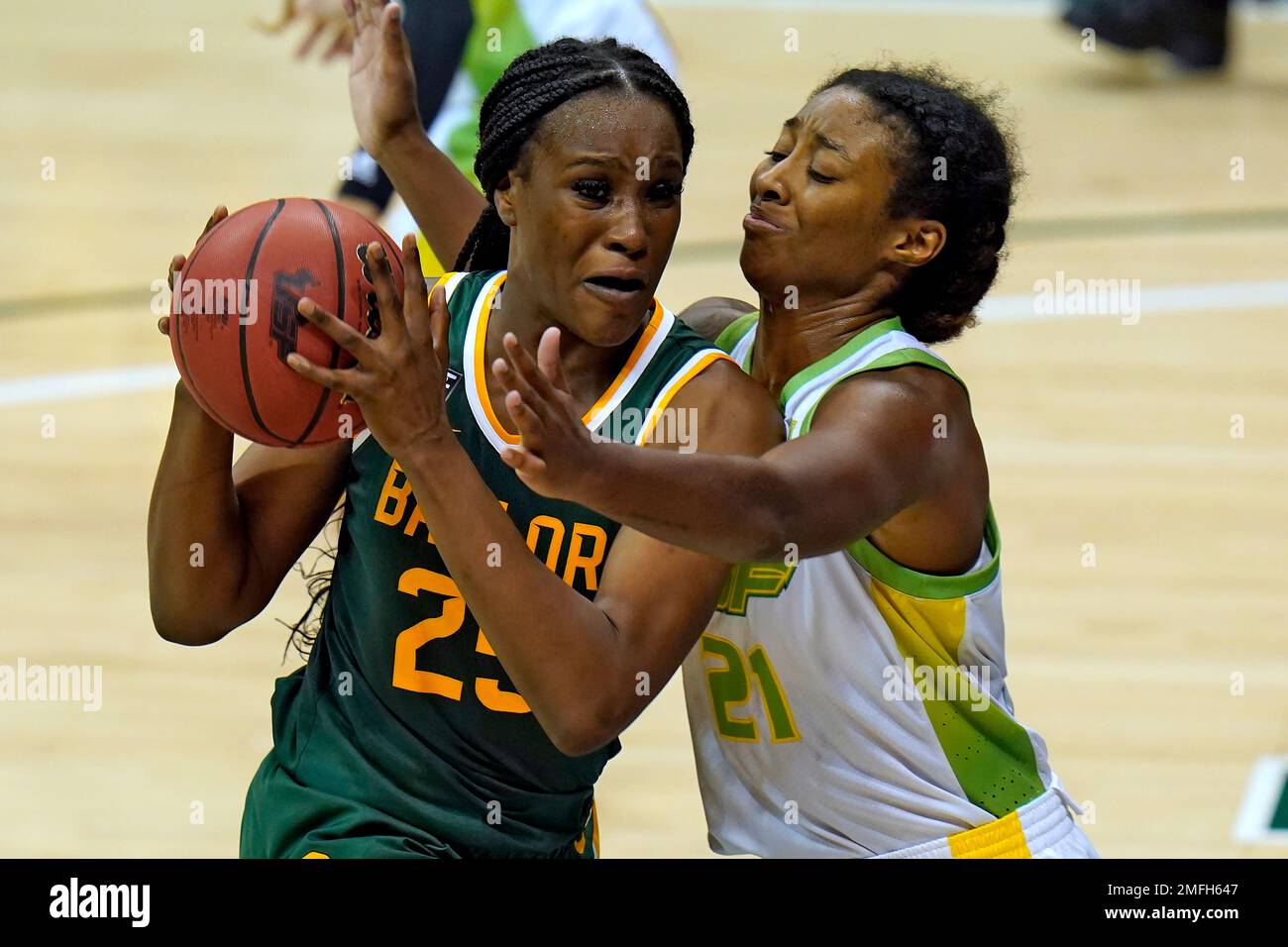 Baylor center Queen Egbo (25) drives against South Florida center Shae ...