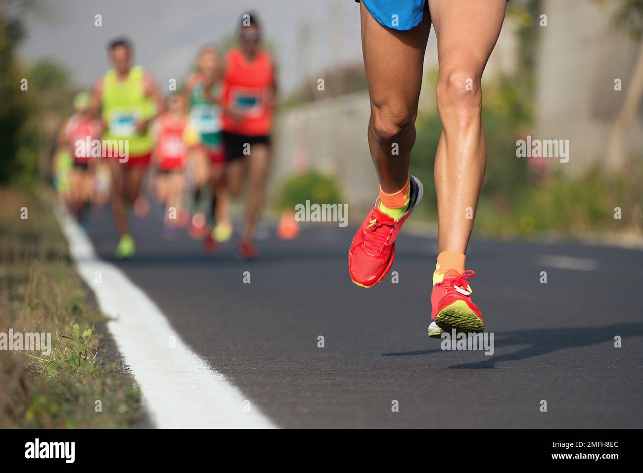 Marathon running race, runners feet on road Stock Photo - Alamy