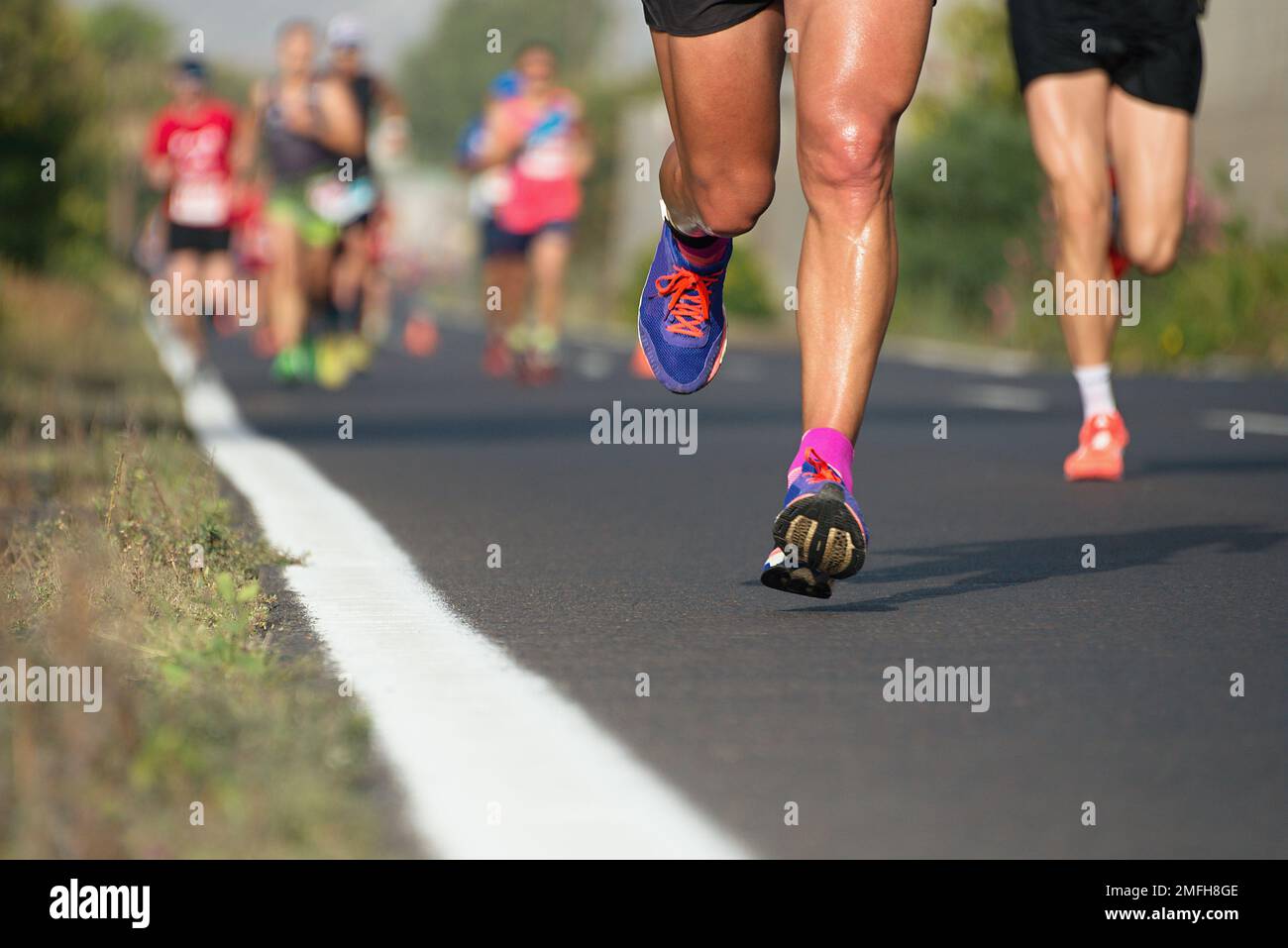 Marathon running race, runners feet on road Stock Photo - Alamy