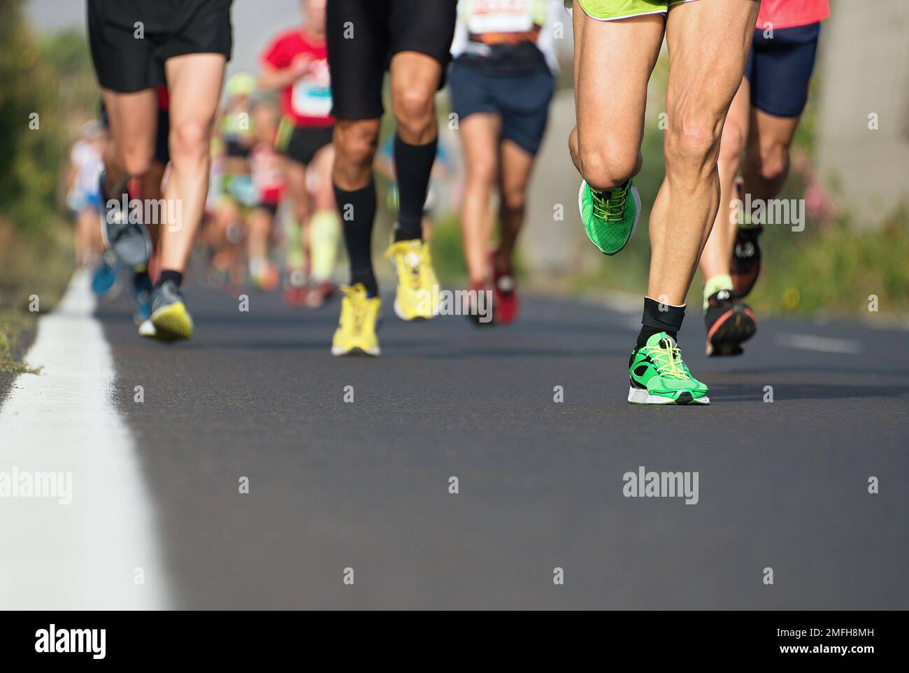 Marathon running race, runners feet on road Stock Photo - Alamy