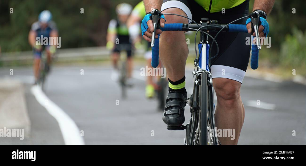 Cycling competition, cyclist athletes riding a race Stock Photo - Alamy