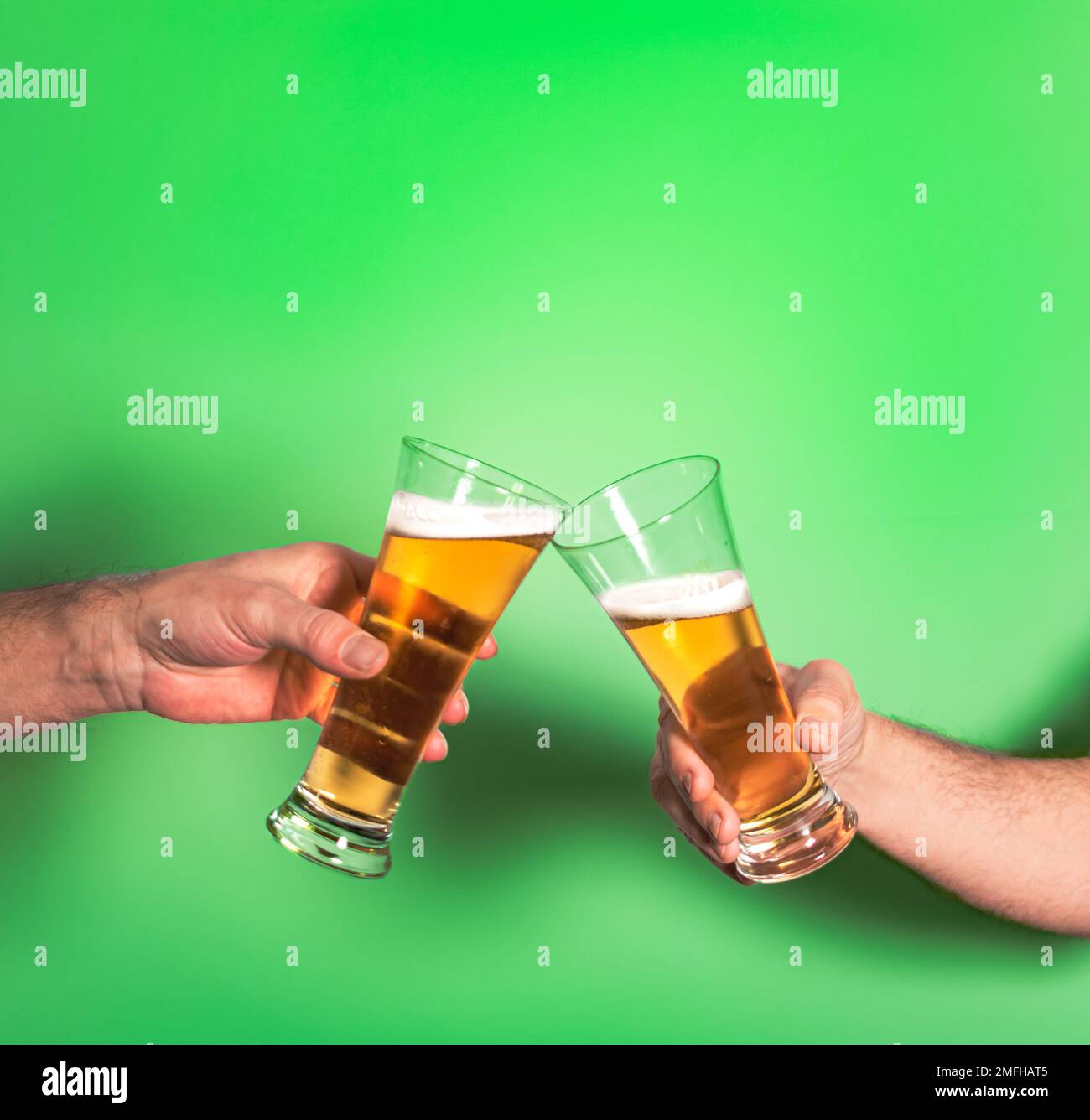 Man holding two a pint of lager hi-res stock photography and images - Alamy