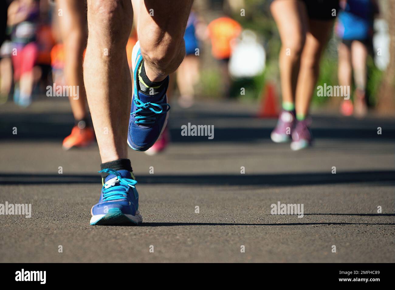 Marathon running in the light of evening Stock Photo - Alamy
