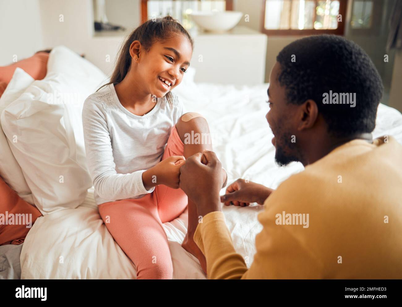 Black family, girl and father fist bump for love, bonding or care in bedroom. Hands gesture ...