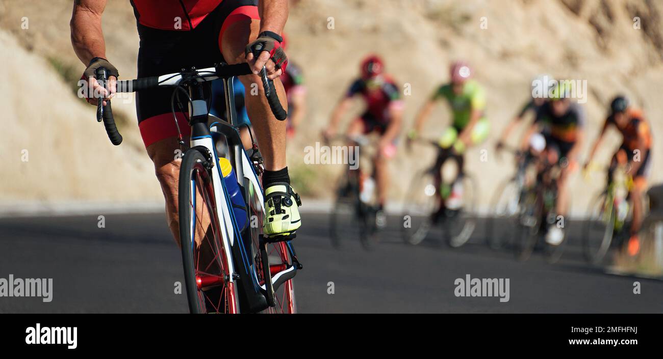 Cycling competition, cyclist athletes riding a race,climbing up a hill ...