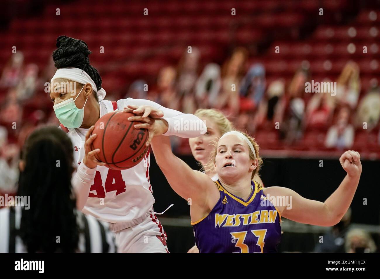 Wisconsin's Imani Lewis (34) against Western Illinois' Anna Deets (33 ...