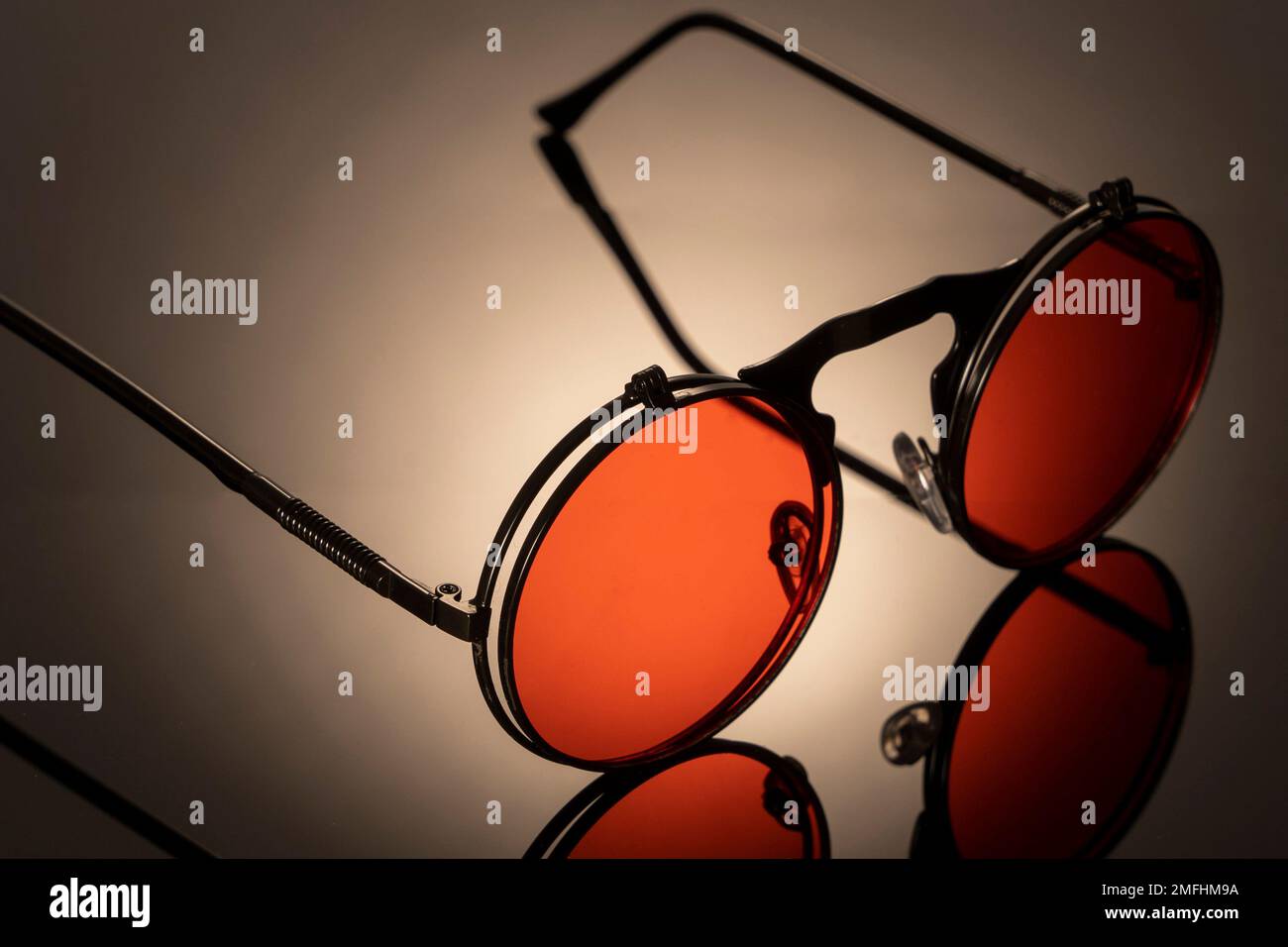 steampunk glasses with red folding glasses on a dark background Stock ...