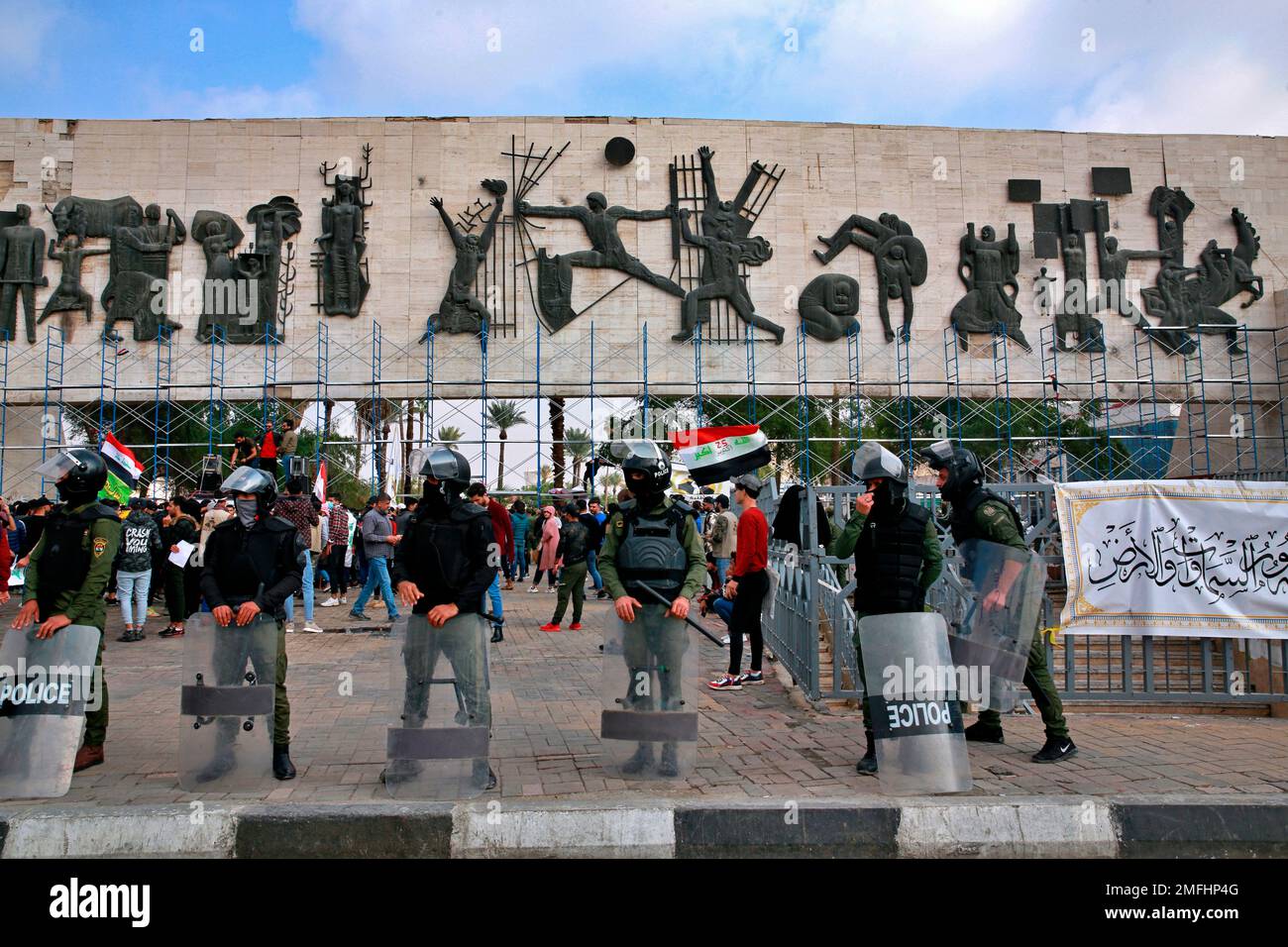 Riot police stand guard in Tahrir Square during a demonstration calling ...