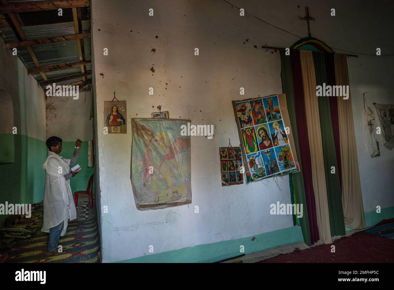 A Tigrayan man who fled the conflict in Ethiopia's Tigray region, prays ...