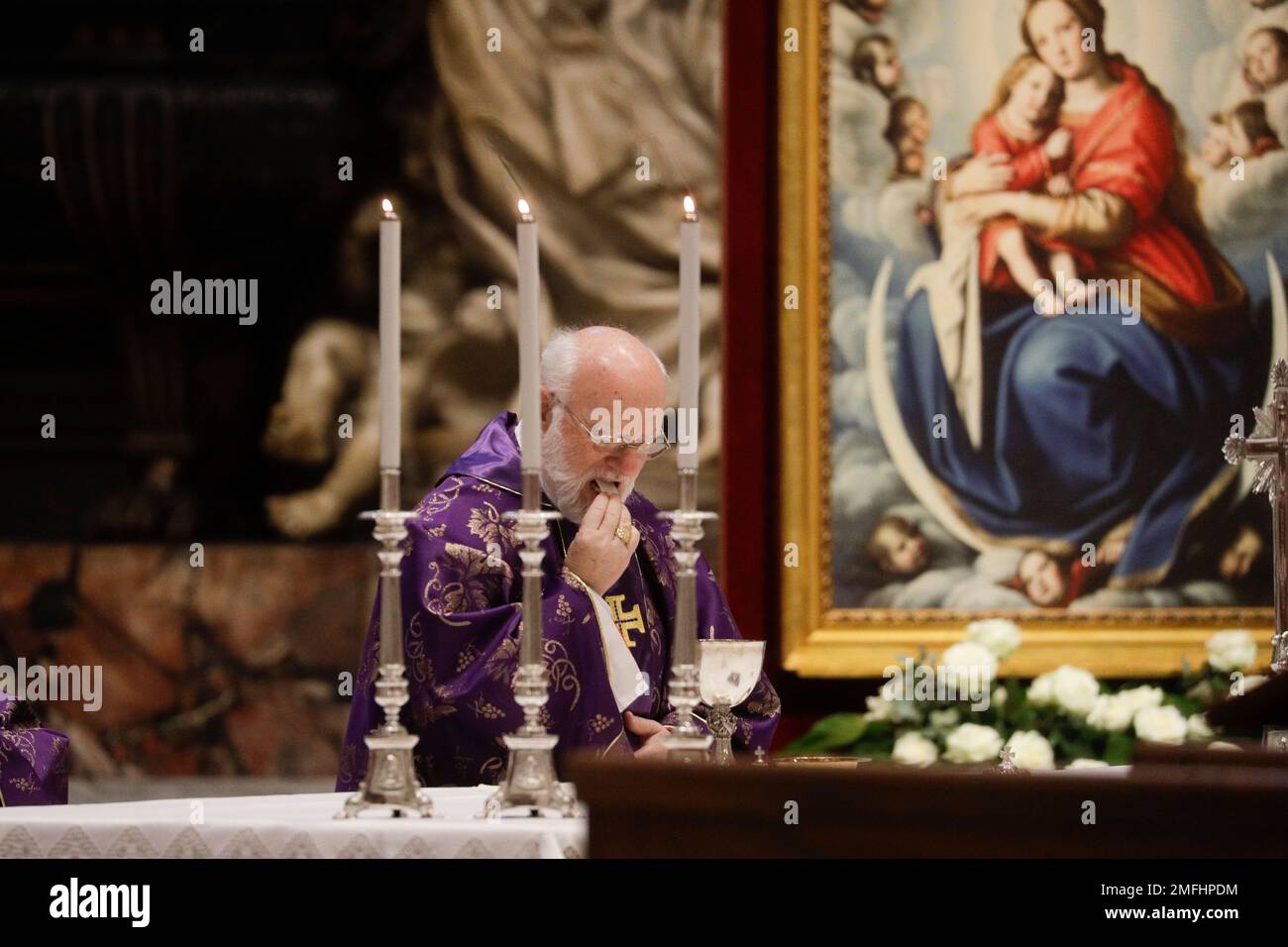 Cardinal Celestino Aos Braco takes communion as he attends a Mass ...