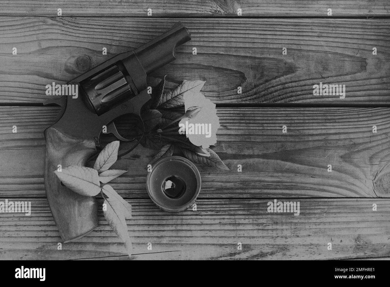 vintage still life with gun and rose in black and white Stock Photo - Alamy