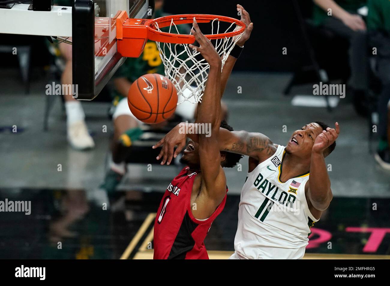 Baylor's Mark Vital (11) fouls Louisiana-Lafayette's Theo Akwuba during ...