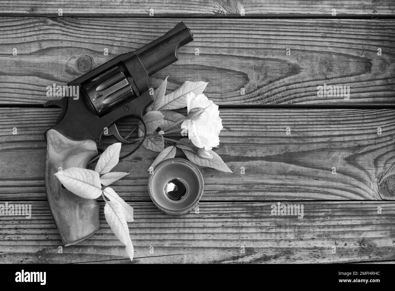 vintage still life with gun and rose in black and white Stock Photo - Alamy