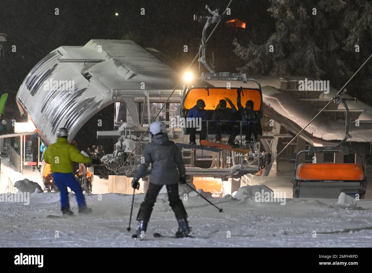 Skiers, snowboaders enjoy night skiing in Klinovec Ski Resort in Ore ...