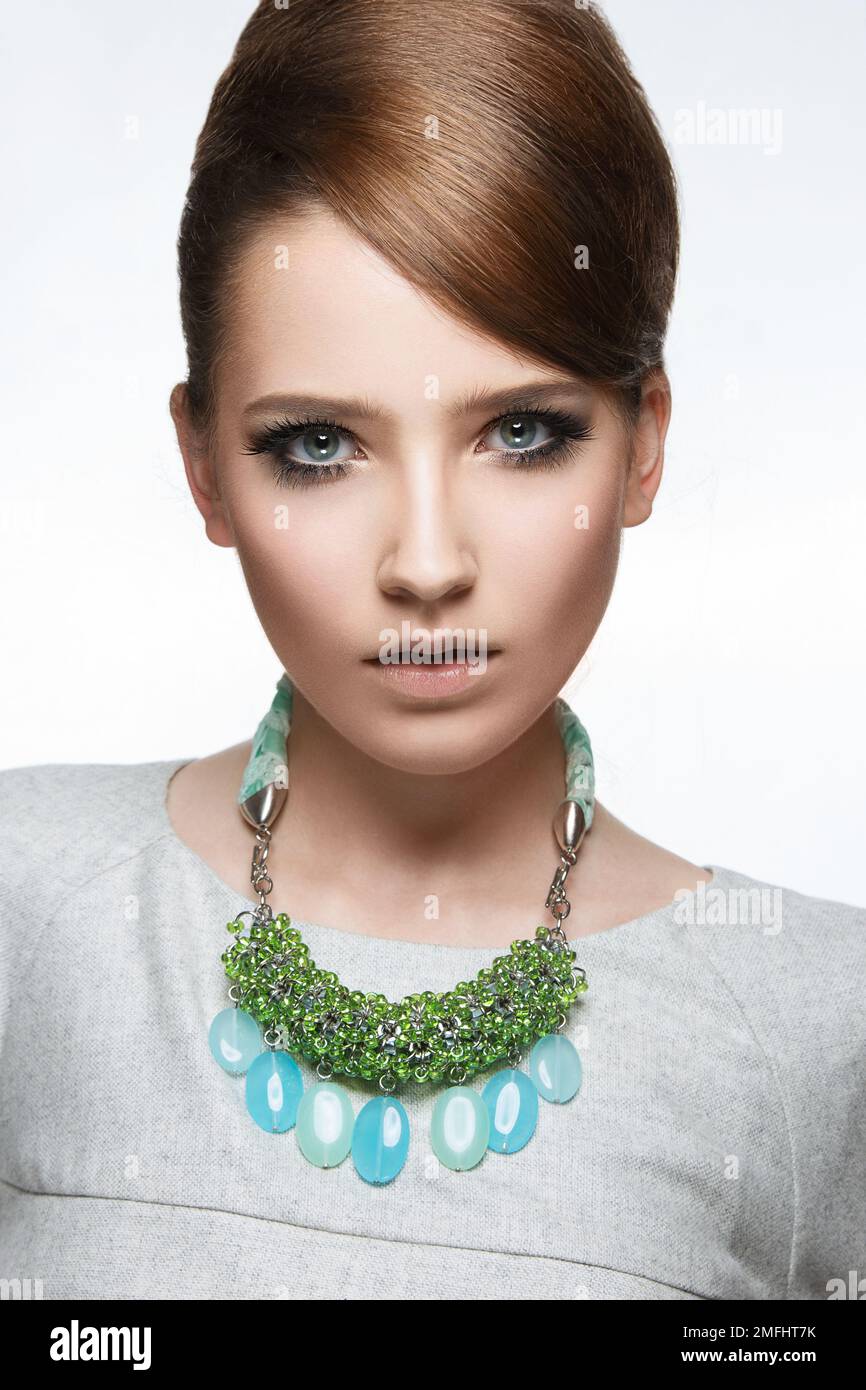 Beautiful fashionable girl with smooth hair and original decoration ...