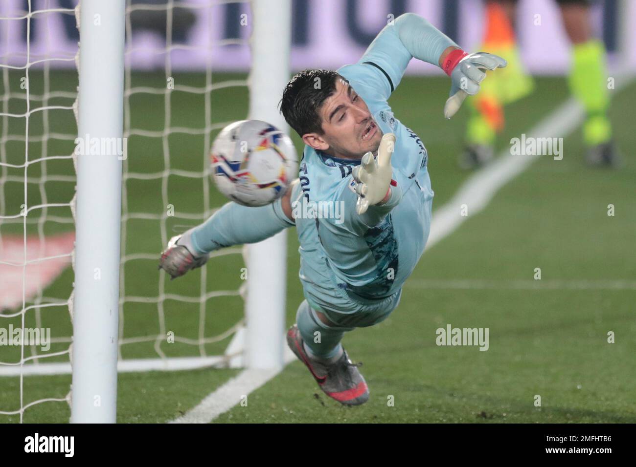 Real Madrid's goalkeeper Thibaut Courtois fails to stop a penalty kick ...