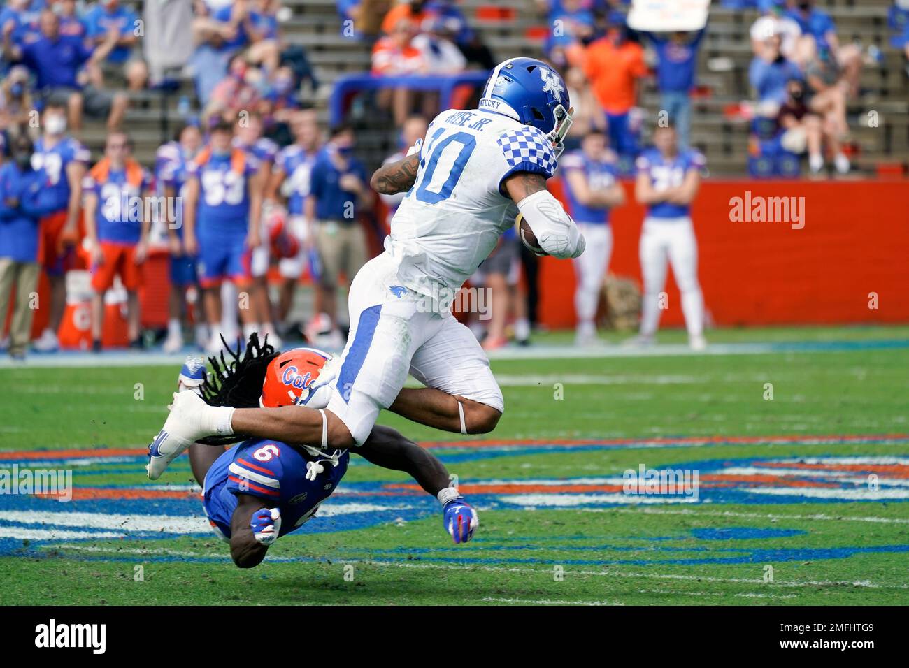 Kentucky running back Asim Rose Jr., right, tries to leap over Florida ...