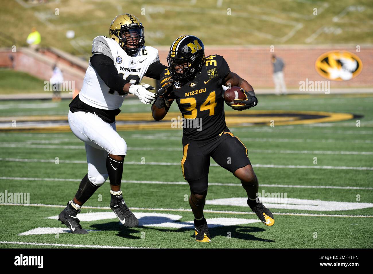 Missouri running back Larry Rountree III, right, runs with the ball as ...