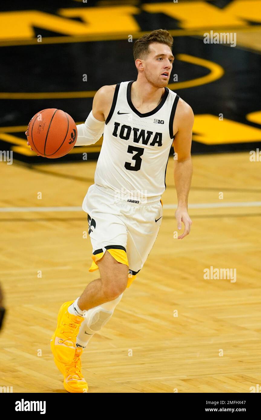 Iowa guard Jordan Bohannon drives up court during an NCAA college ...