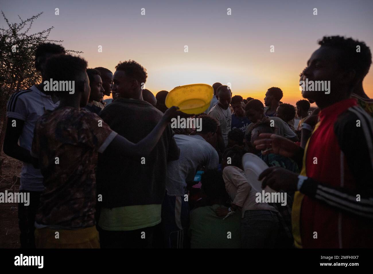 Tigray men who fled the conflict in Ethiopia's Tigray region, wait to ...
