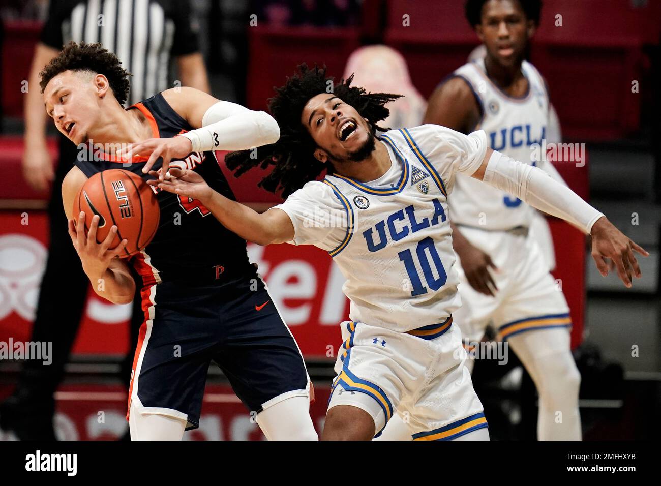 UCLA guard Tyger Campbell (10) loses the ball to Pepperdine guard ...