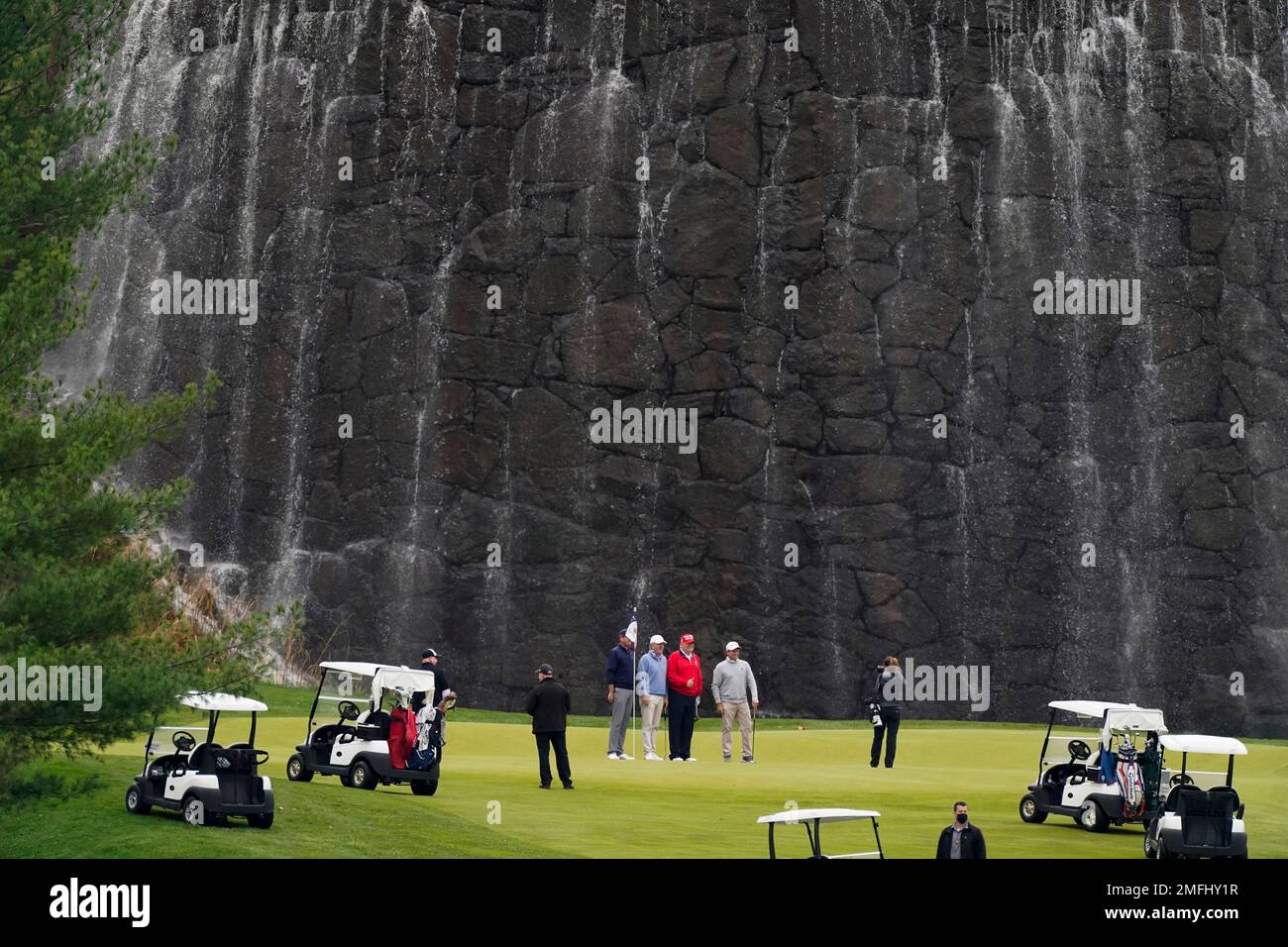 President Donald Trump poses for a photo after playing golf at Trump ...