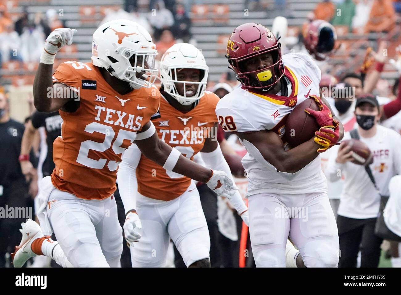 Iowa State running back Breece Hall (28) runs past Texas defensive back ...