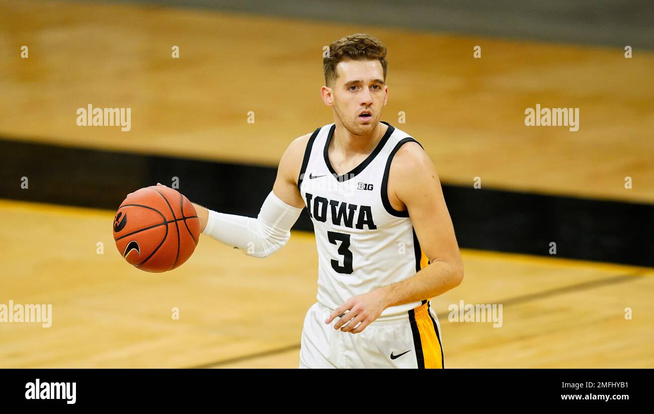 Iowa guard Jordan Bohannon drives up court during an NCAA college ...